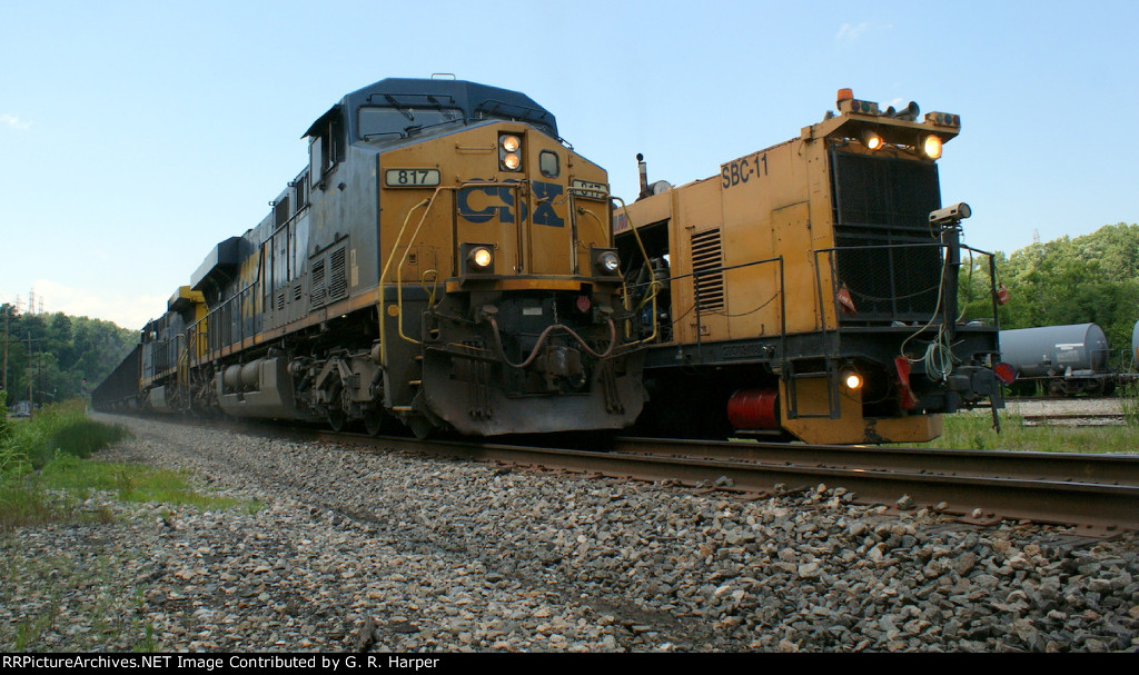 T227 with CSXT 817 and Loram ballast cleaner side by side